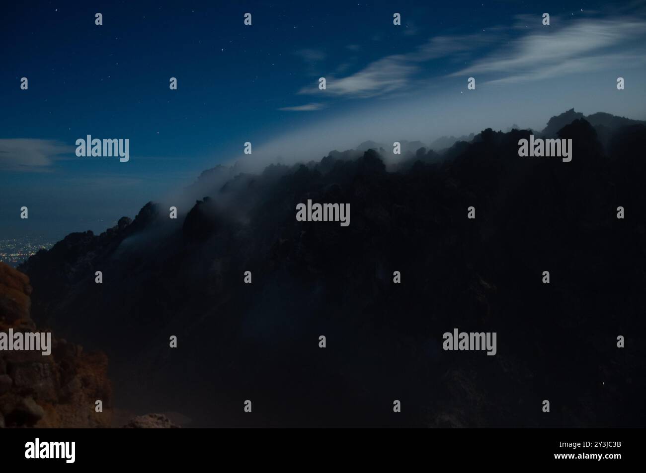 Night view of sulphurous smoke from Merapi Volcano coming out of the ...