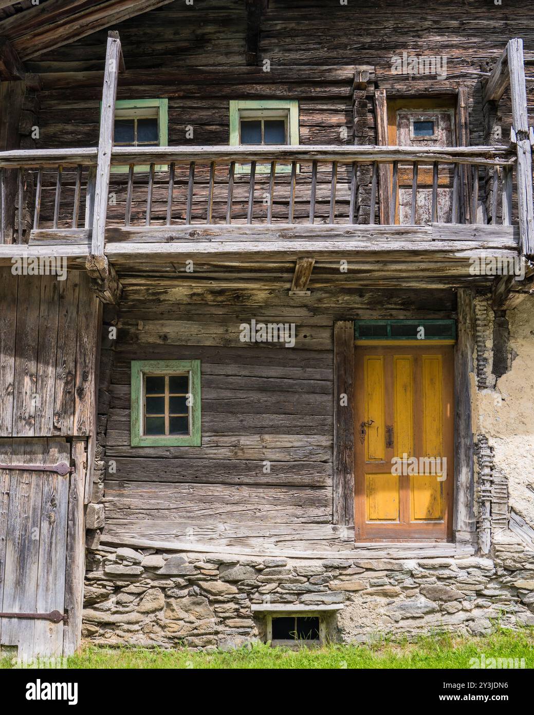 Details of an old wooden house, small windows. Old wooden in the ...