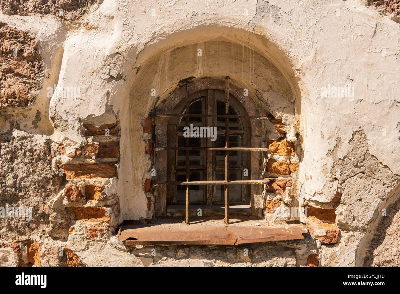 small window in the stone wall of a medieval building Stock Photo - Alamy