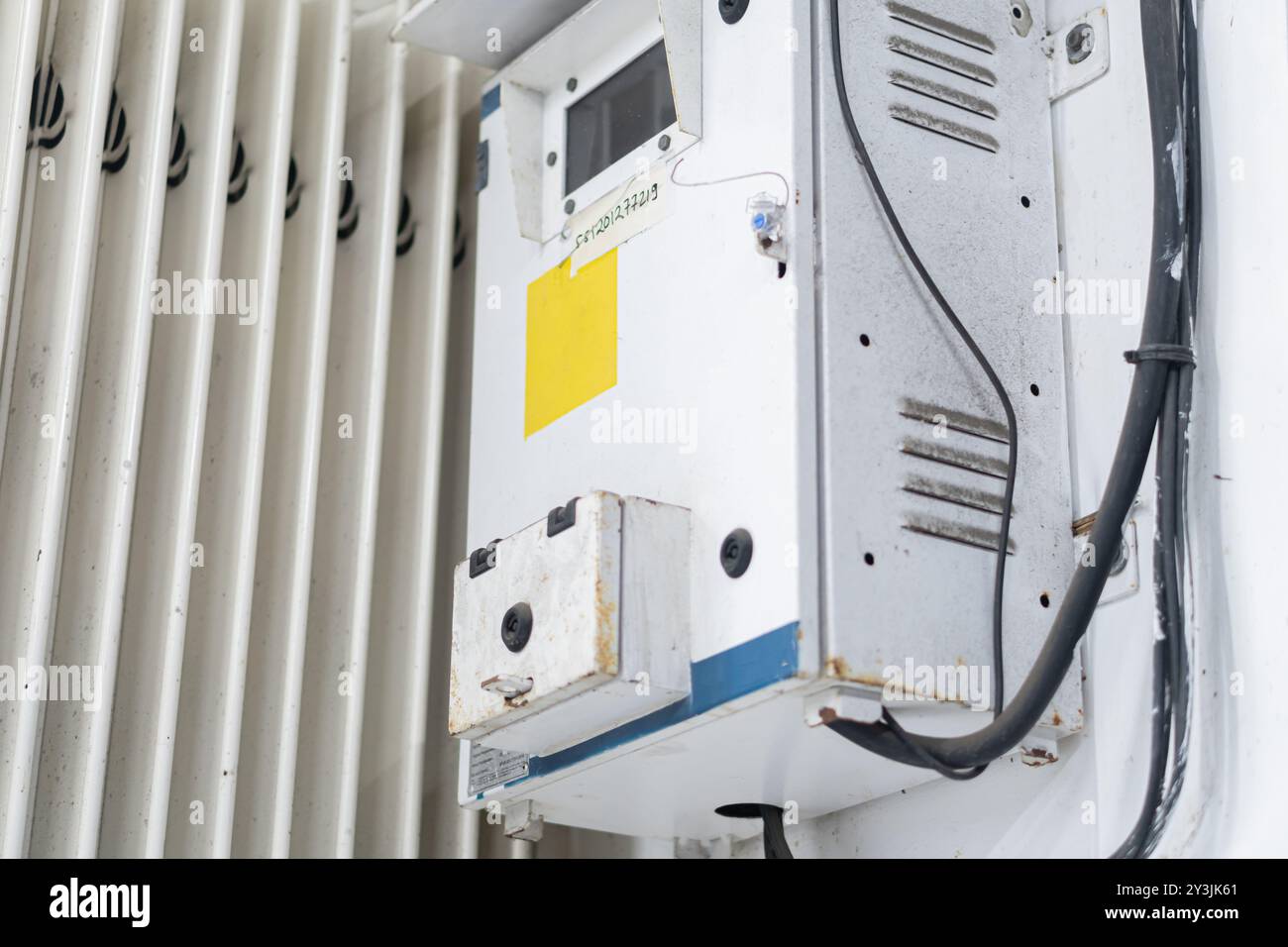 A close-up view of an electrical meter mounted on a wall, featuring a ...