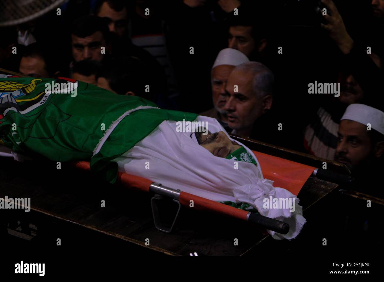 Hundreds of Palestinians take part in the funeral of Imad al-Alami, a ...