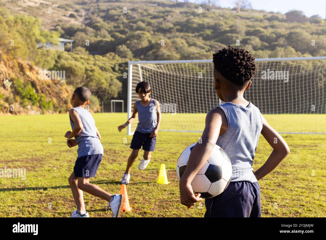 Practicing soccer drills kids running hi-res stock photography and ...