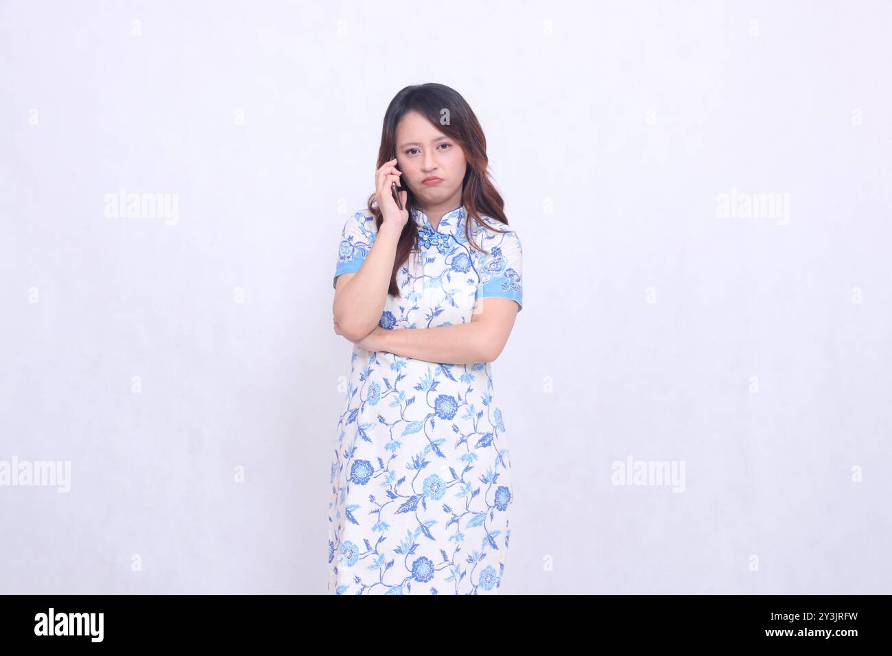 Young Asian Javanese Chinese girl very disappointed wearing blue ...