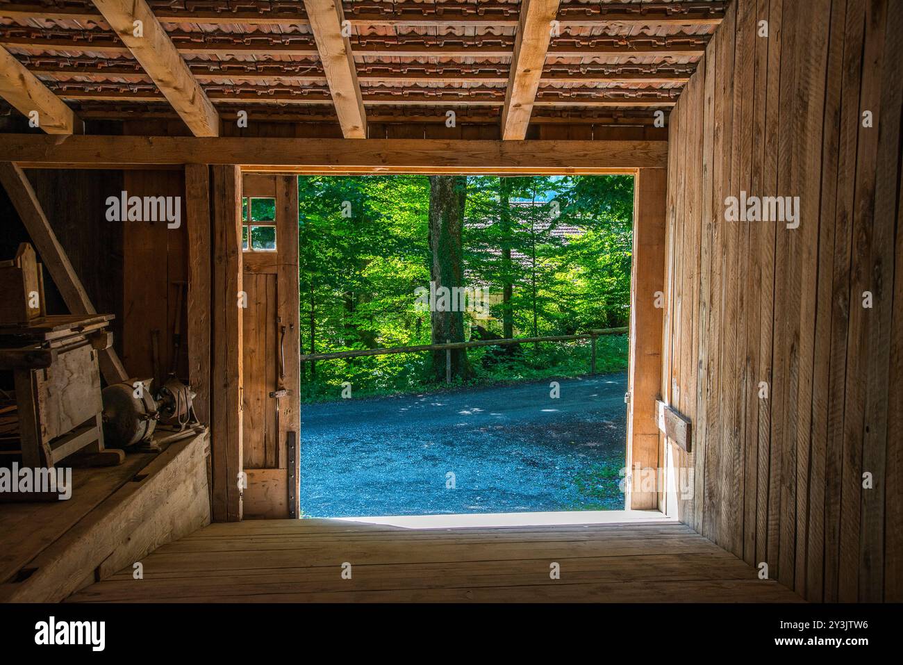 Traditional Swiss Wooden Shed Framing a Forest View Stock Photo - Alamy