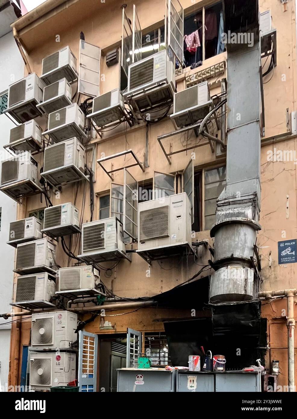 Singapore, 1 June 2024: many air-cons on the back-street facade of ...