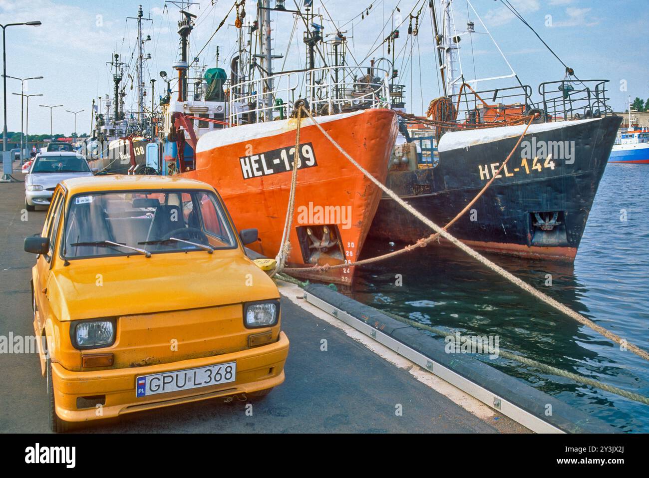 Fishing boats, old Polski Fiat 126p car at port in Hel, Hel Peninsula ...