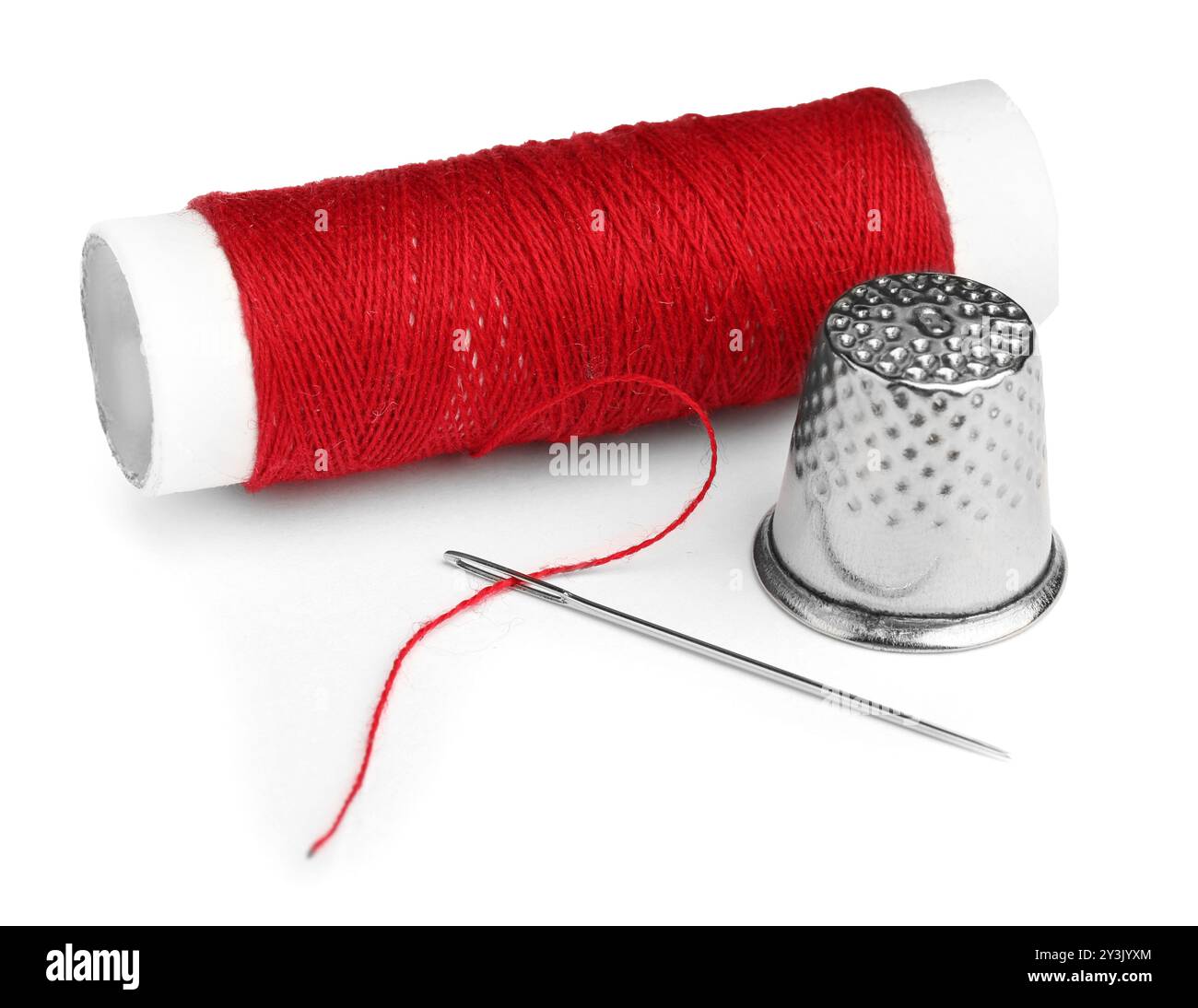 Thimble and needle with red sewing thread isolated on white Stock Photo ...