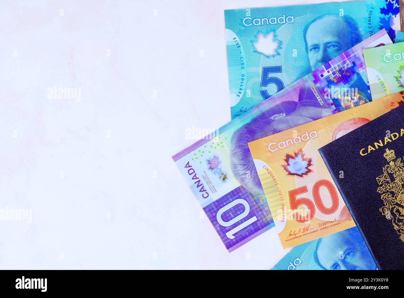 Passport issued by Canadian government with Canada banknotes in ...