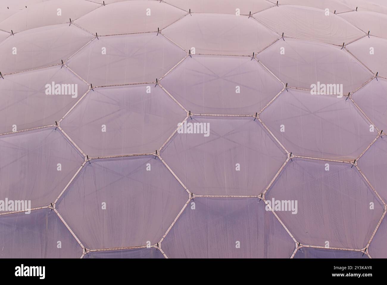 Close-up view of a geodesic dome structure featuring hexagonal panels, showcasing a modern ...