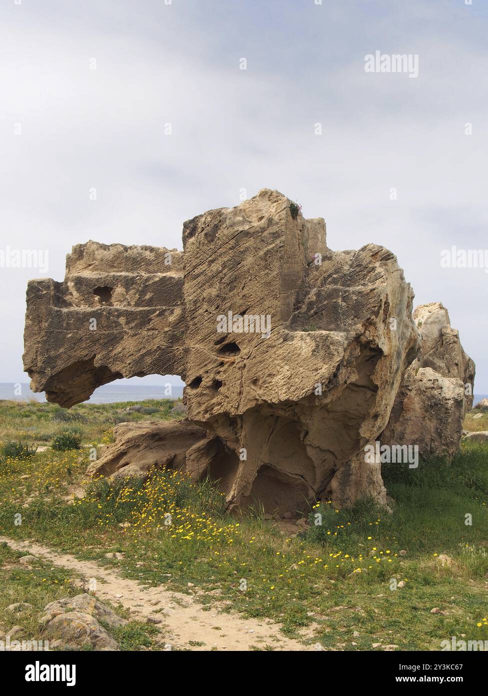Exposed carved stone tomb with steps in the tomb of the kings area in ...