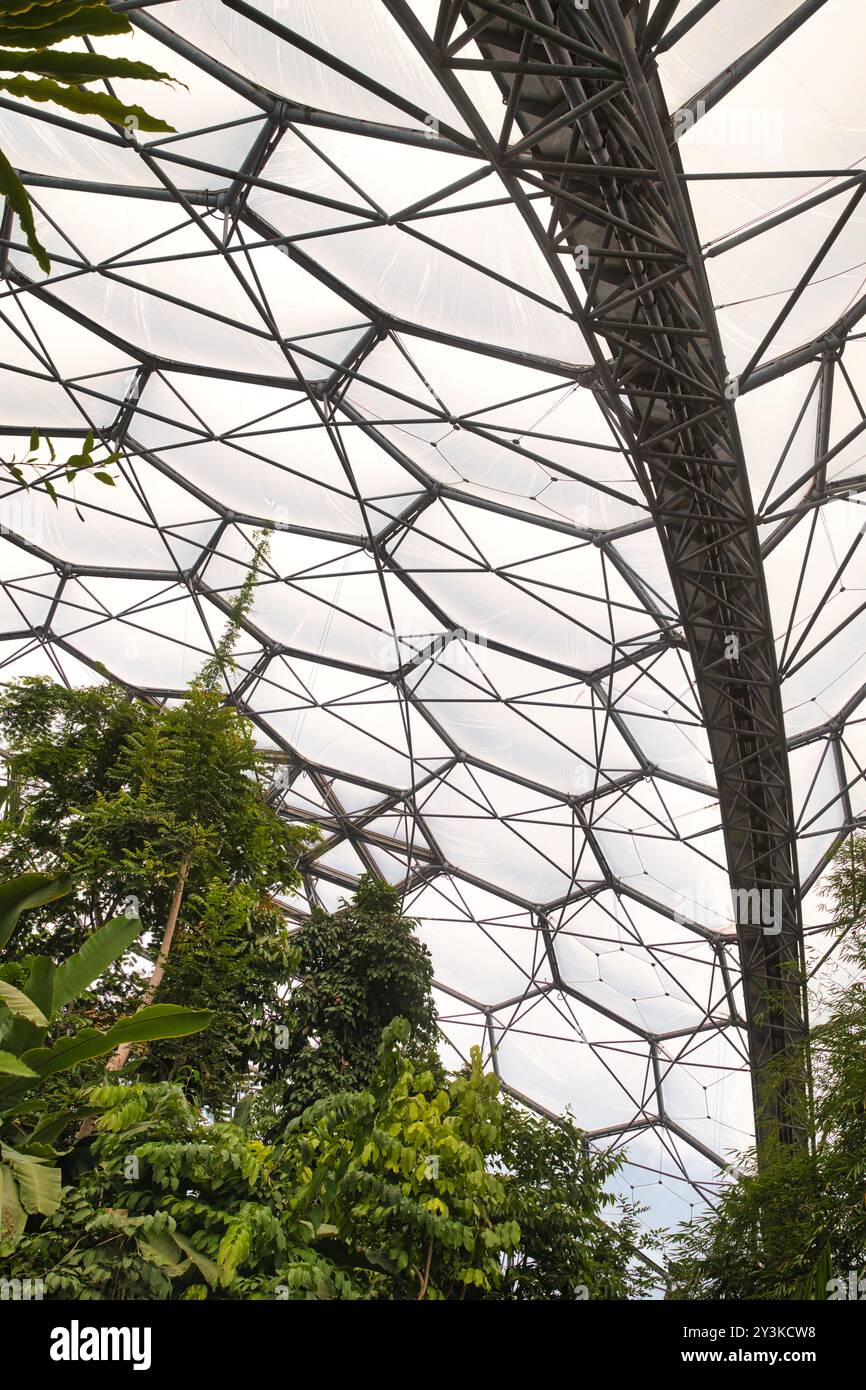 A view of a modern greenhouse structure with a geometric roof design ...