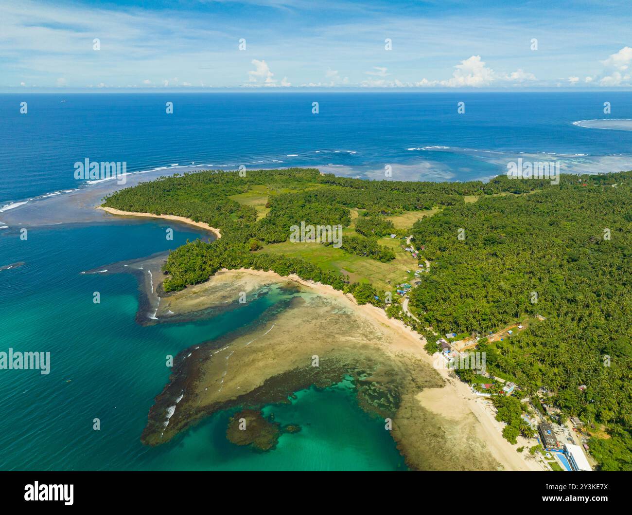 White sand shoreline and the deep blue sea surrounded. Mindanao ...