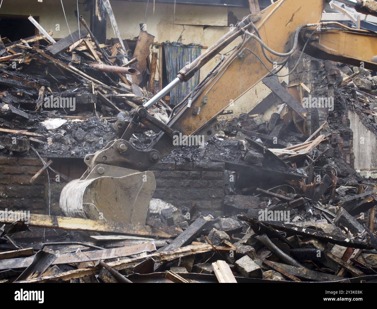 Hydraulic crusher excavator machinery working on a demolition site ...