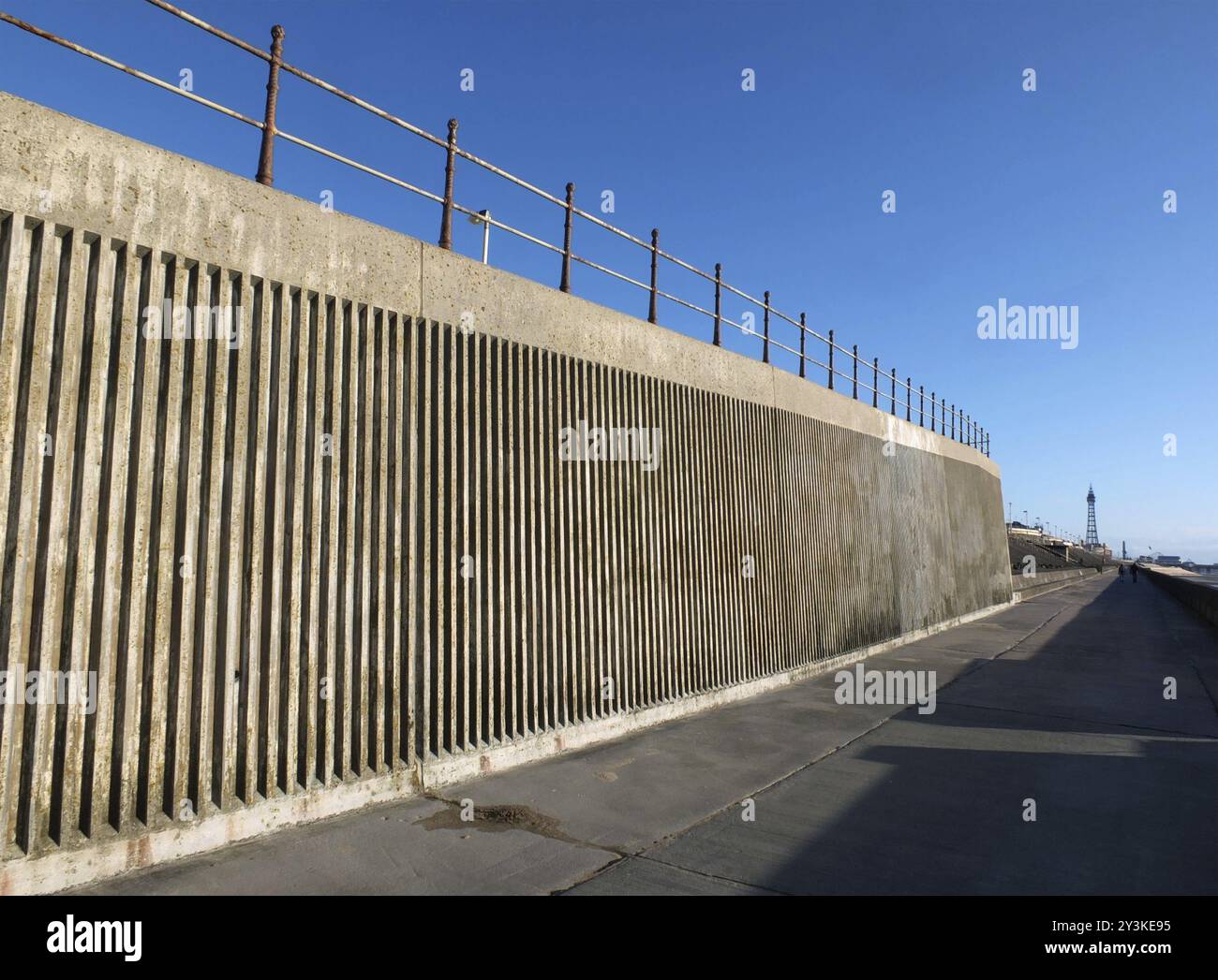 Concrete seawall and railings along the pedestrian promenade in north ...