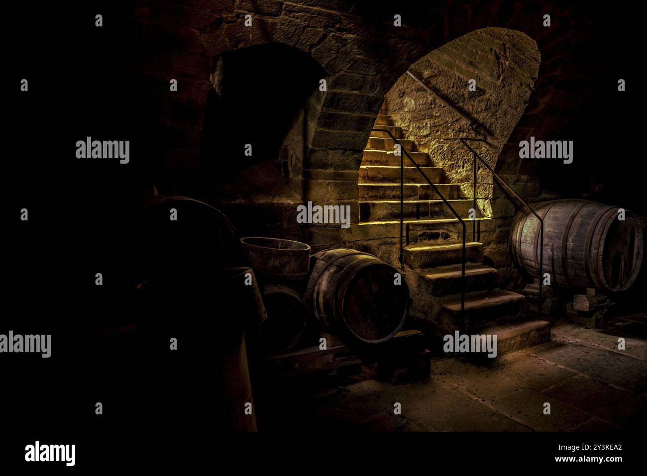 Couple of big wooden barrels stored in an antique wine cellar in a ...