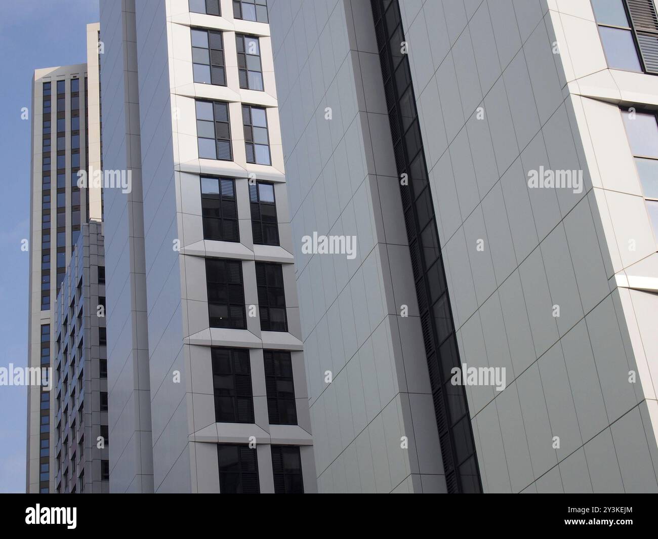 Close up perspective detail of a row of tall high rise modern apartment ...