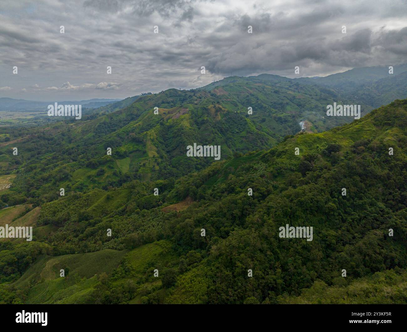 Tropical mountain slopes and hills with lush foliage in the Philippines ...
