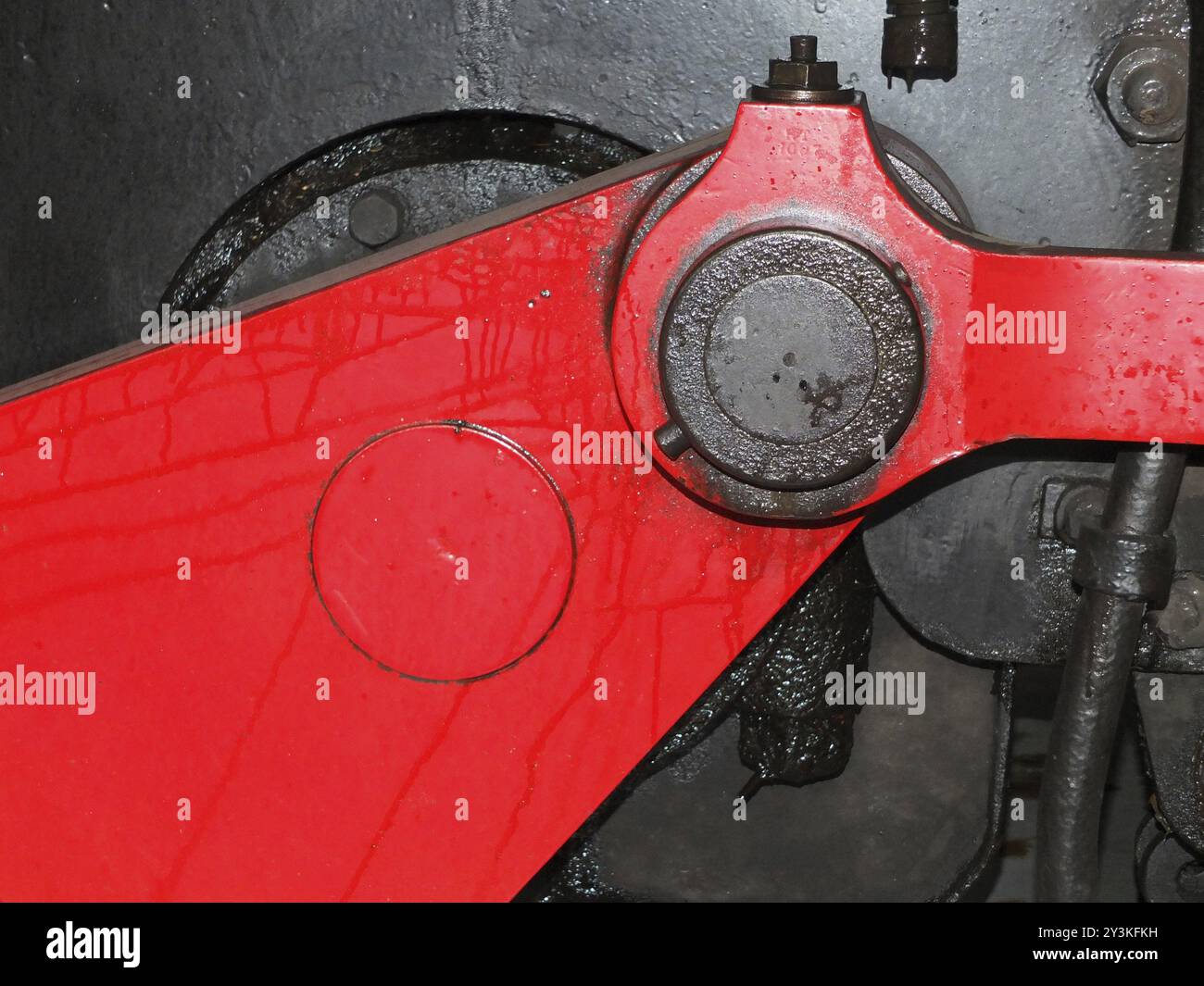 Details of black steam locomotive wheel with red drive and connecting ...
