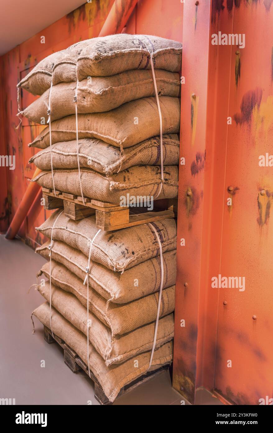 Industrial image of two pallets with goods in burlap sacks, piled upon ...
