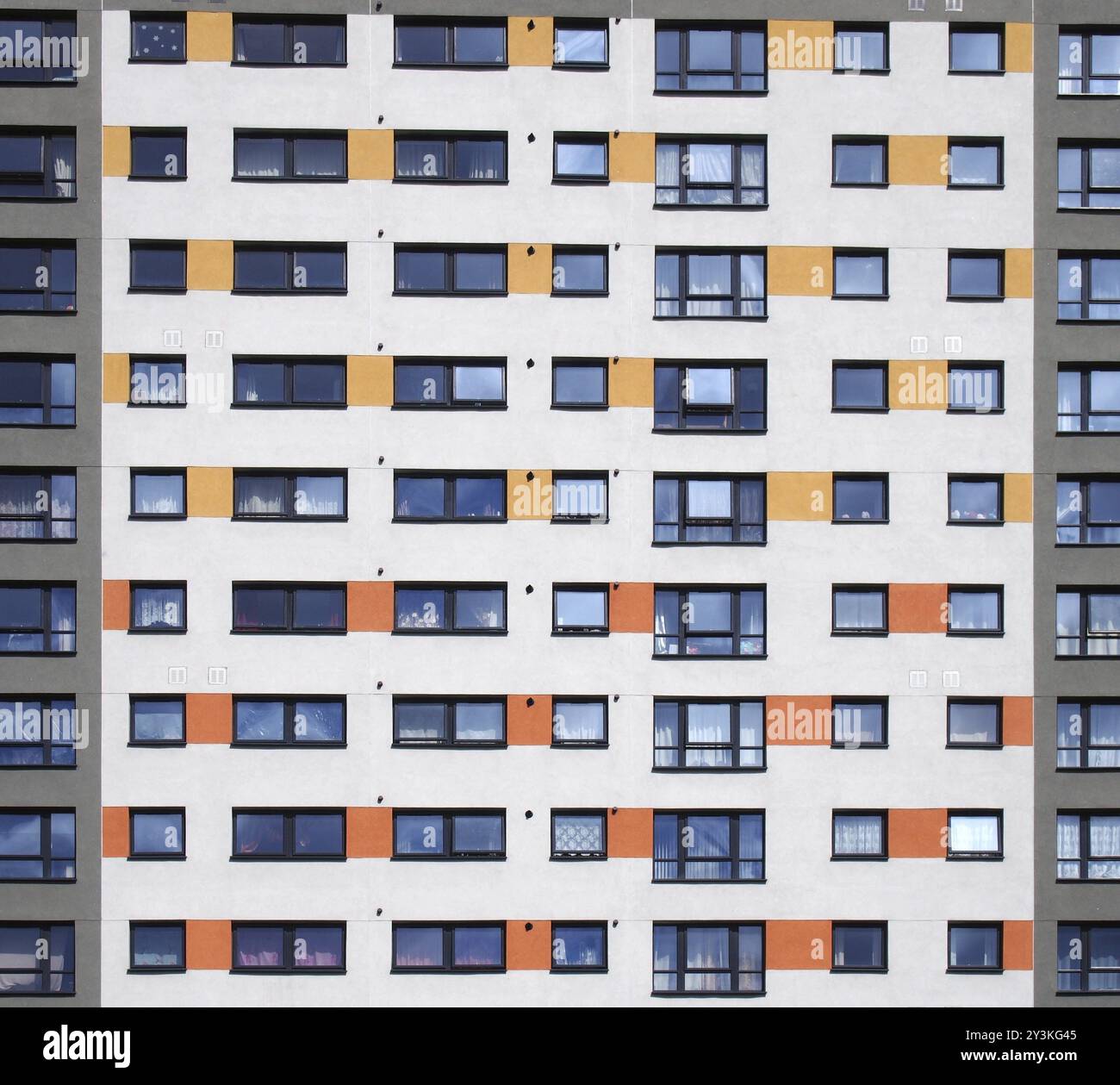 A full frame image of windows in a large high rise apartment building ...