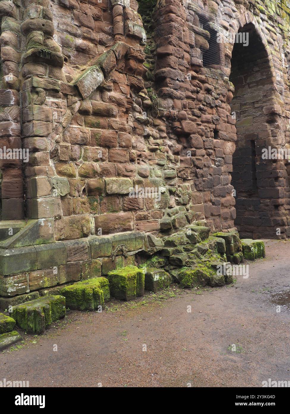 Ruined medieval stone walls of the eastern end of destroyed choir and ...