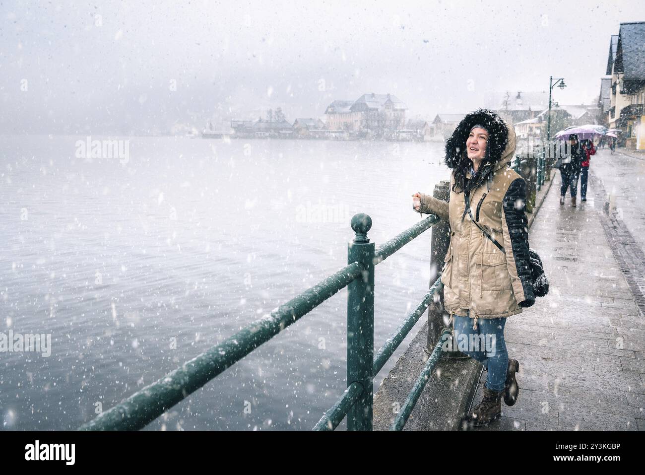 Winter joy theme image with a young woman laughing and enjoying the ...