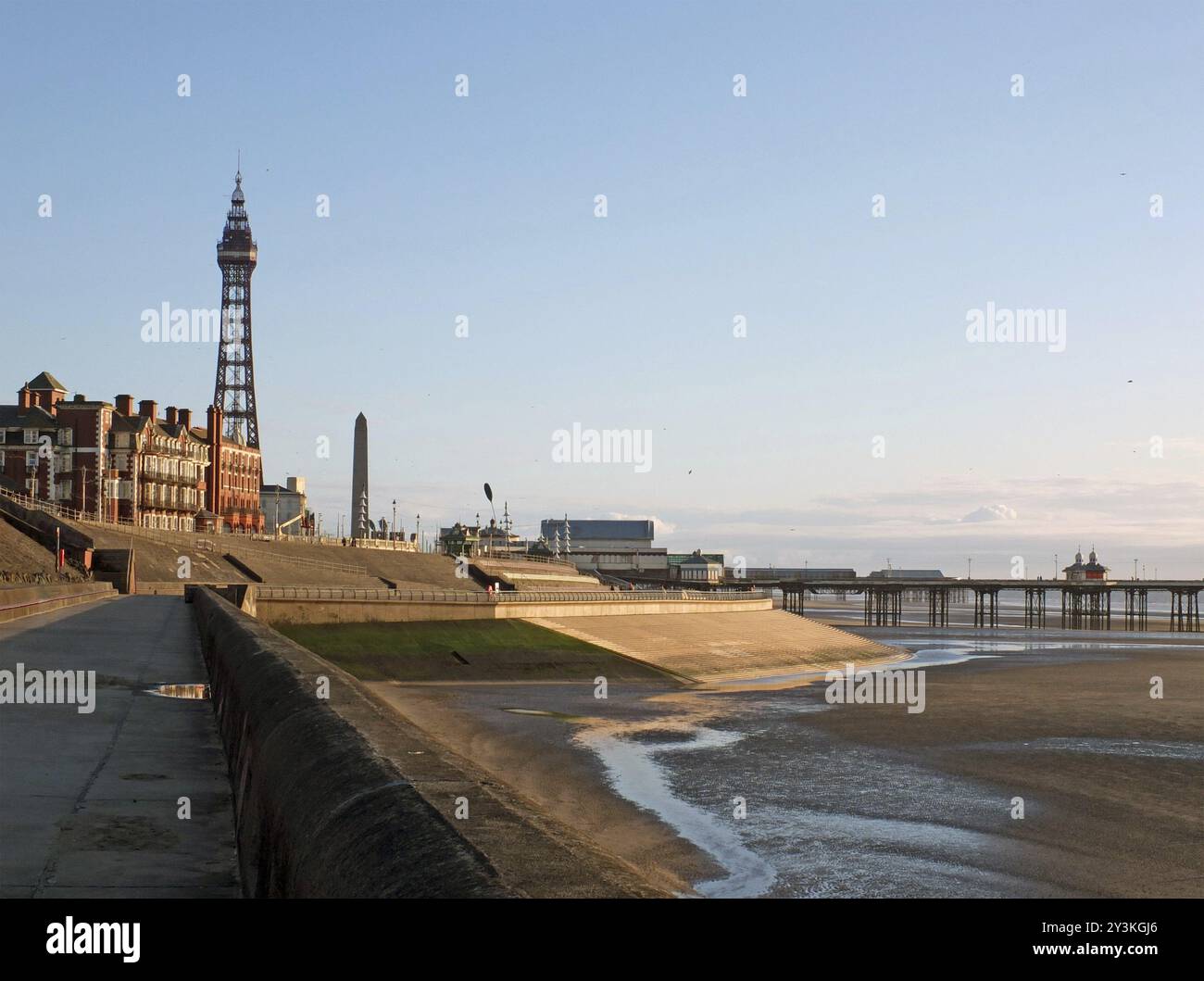 View of blackpool tower and south pier from the promenade with town ...