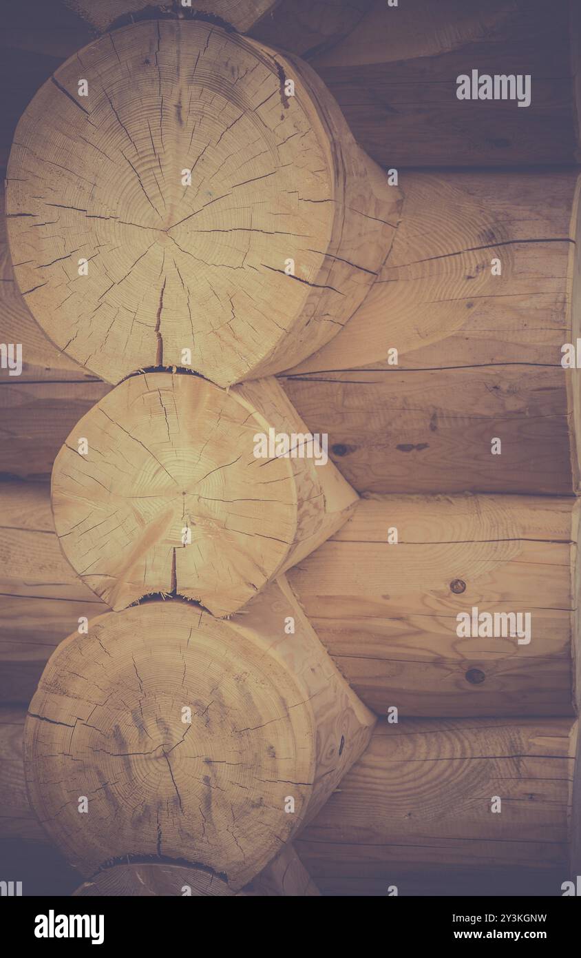 Rustic image with details of a wooden cabin corner, with logs joined ...