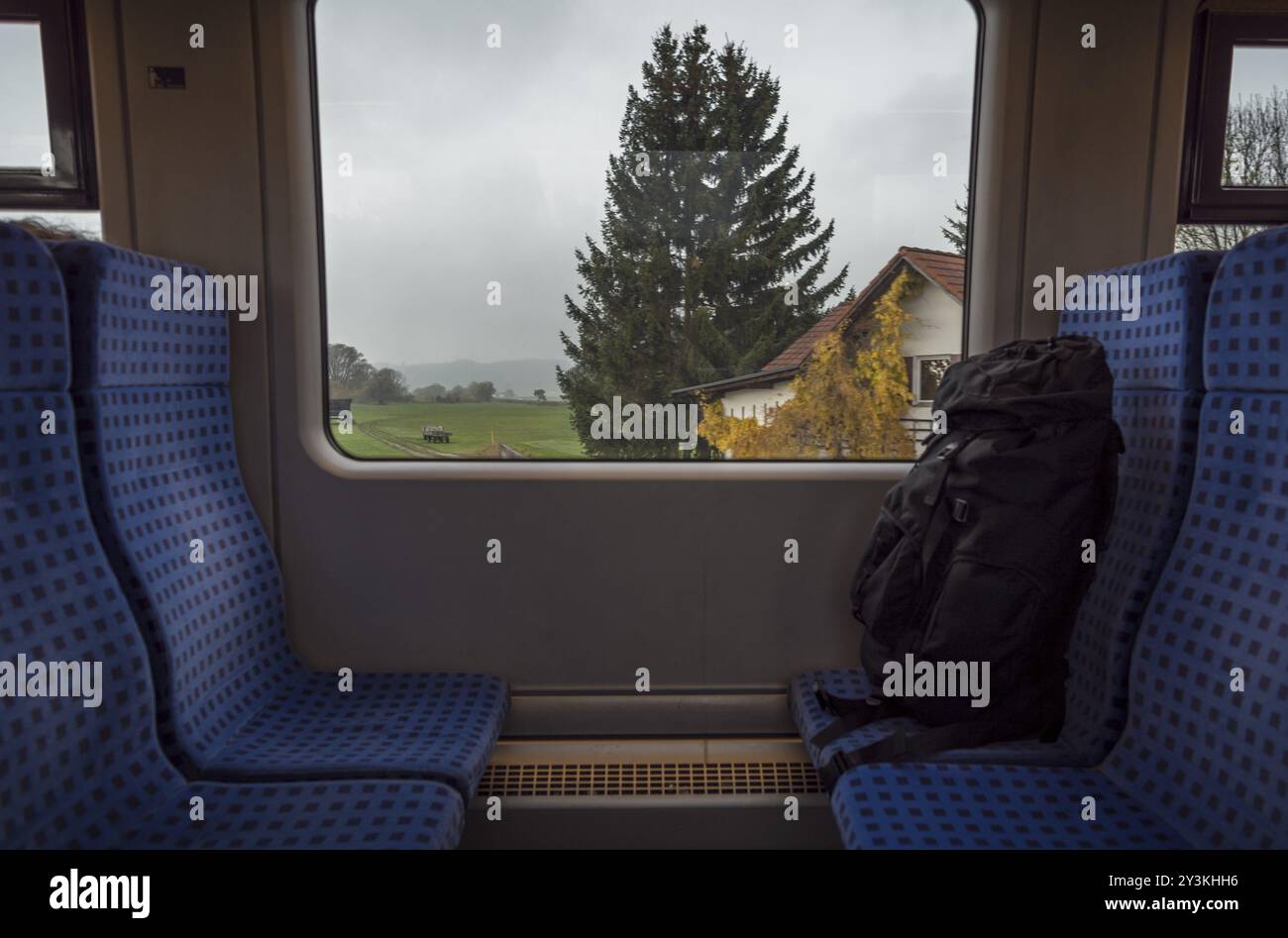 German train interior with a rucksack on the seats and a bavarian ...