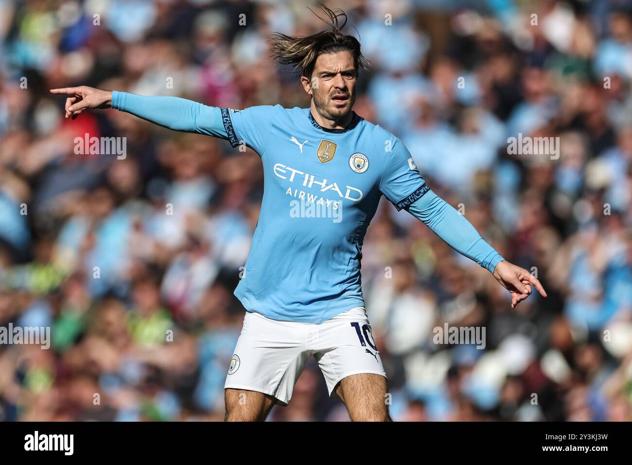 Jack Grealish of Manchester City gives his team instructions during the ...