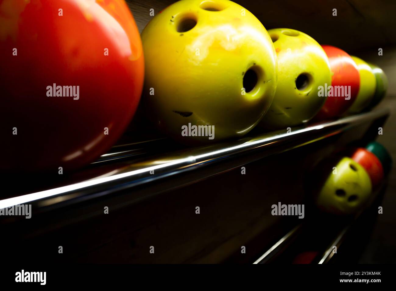 Bowling balls on display. Used low class bowling balls on a rack Stock ...