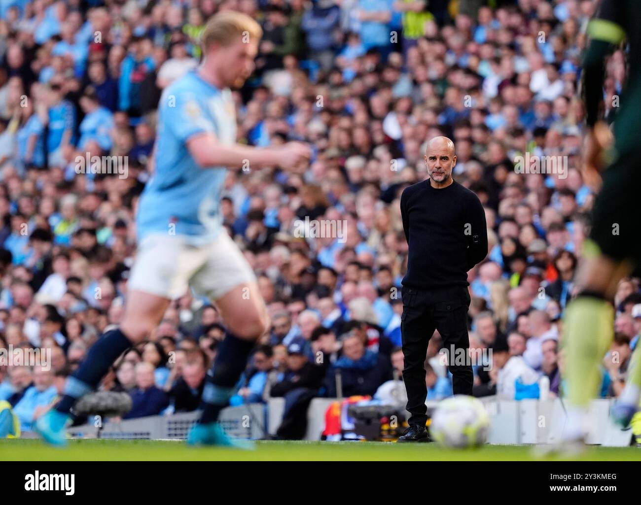 Manchester City manager Pep Guardiola watches Kevin De Bruyne (left) in ...
