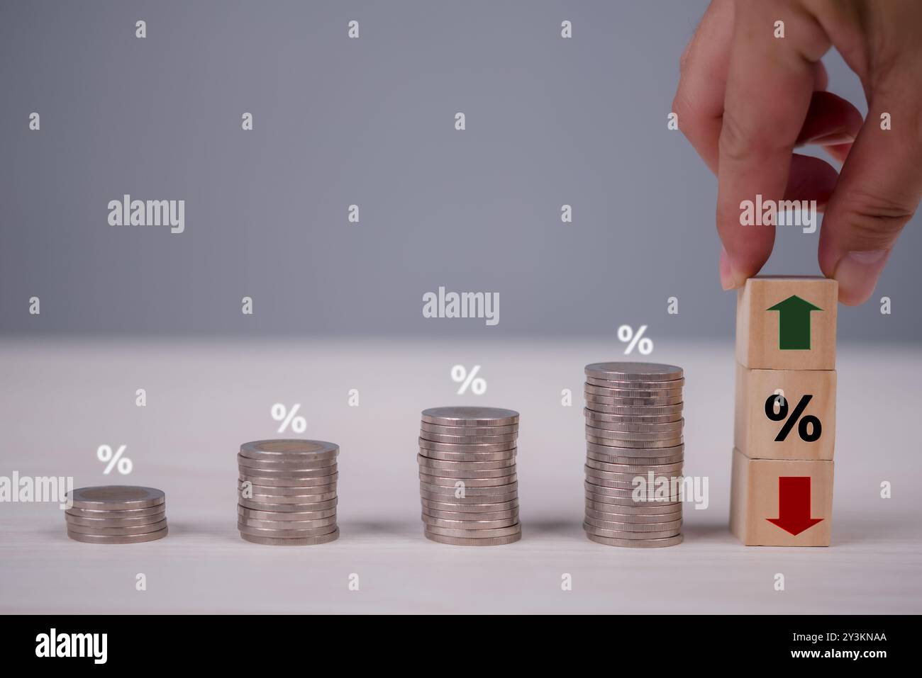 Stacked coins with percentage symbols showing financial growth and ...