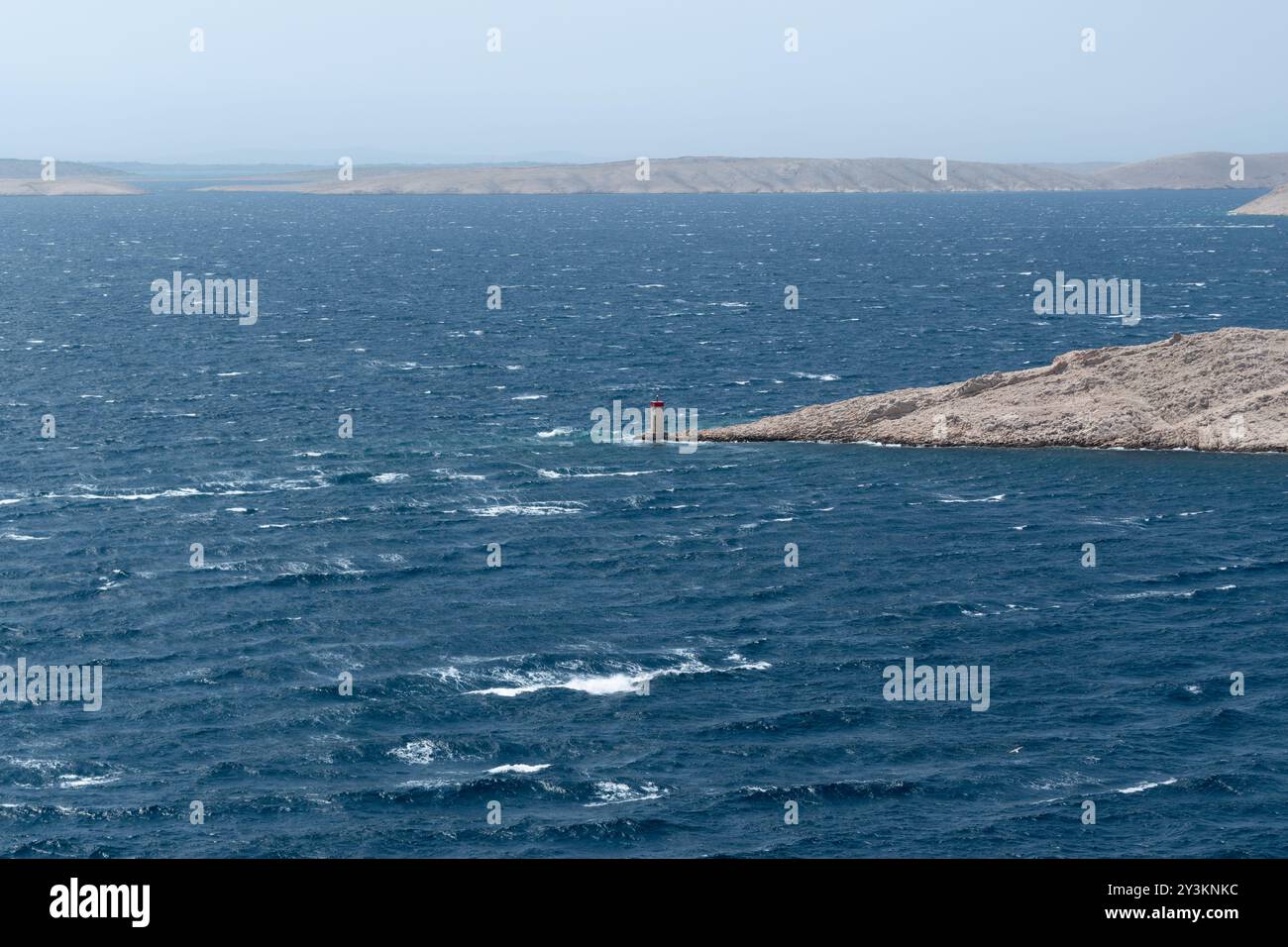 Lighthouse on island reef, rough sea due wind Stock Photo - Alamy