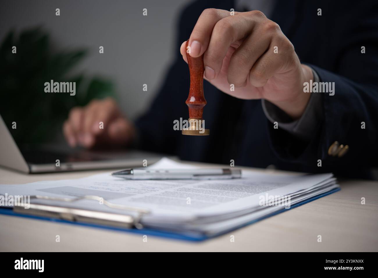 Confident Businessman Stamping Official Document in Modern Office Legal ...