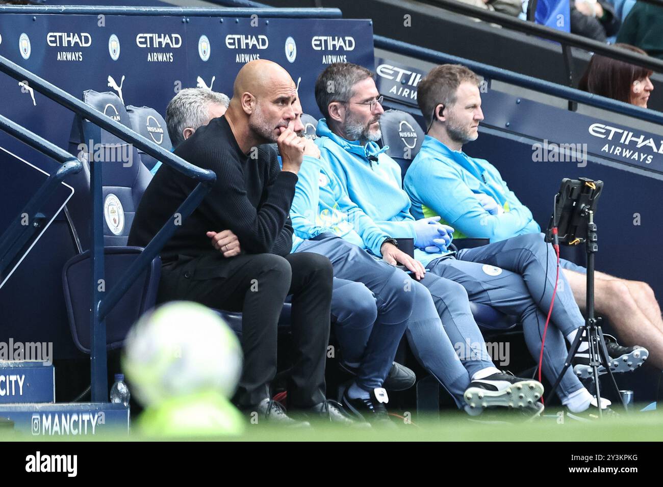 Pep Guardiola manager of Manchester City looks on from the bench during ...