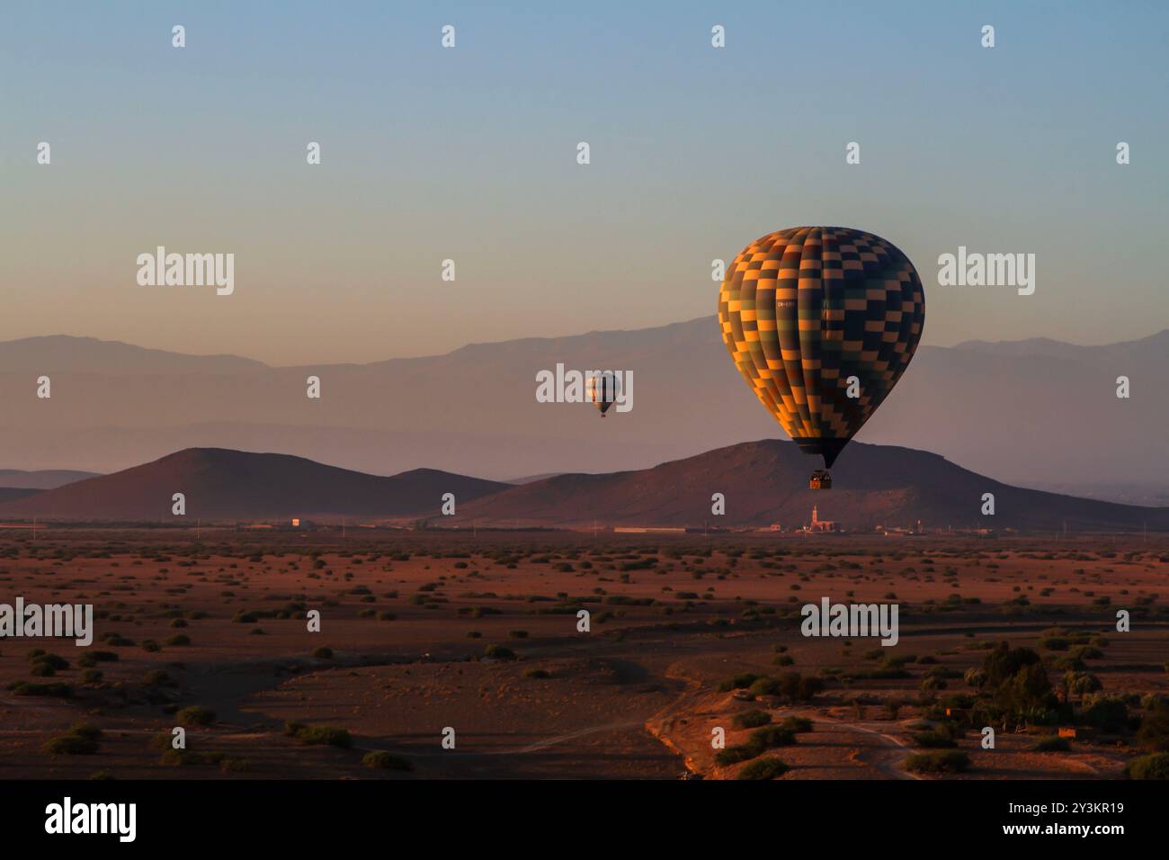 Floating above Morocco's stunning landscapes, this hot air balloon ...