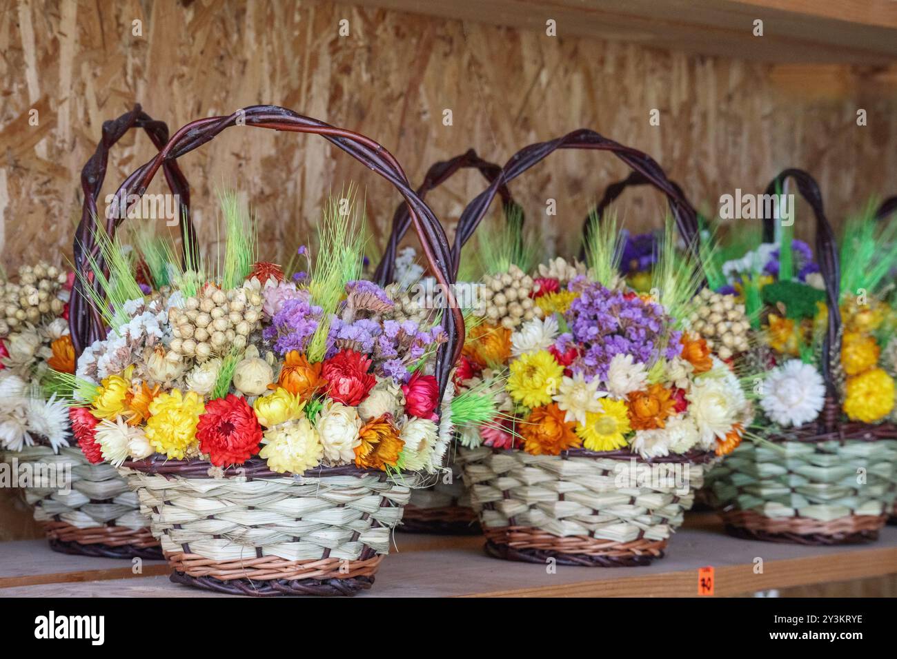 Colorful flower basket with colorful flowers Stock Photo - Alamy