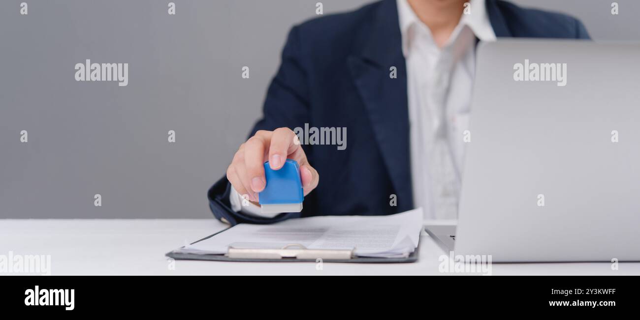 Hand stamping a document, approval and verification in a business ...