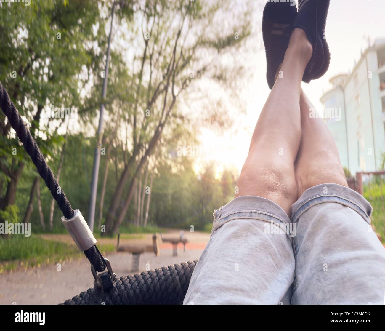 Man swinging on rope hi-res stock photography and images - Alamy