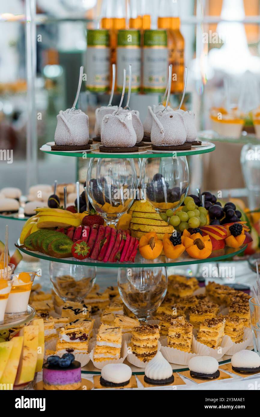 Exquisite Dessert Buffet Display with Fruit and Pastry Delights Stock Photo - Alamy
