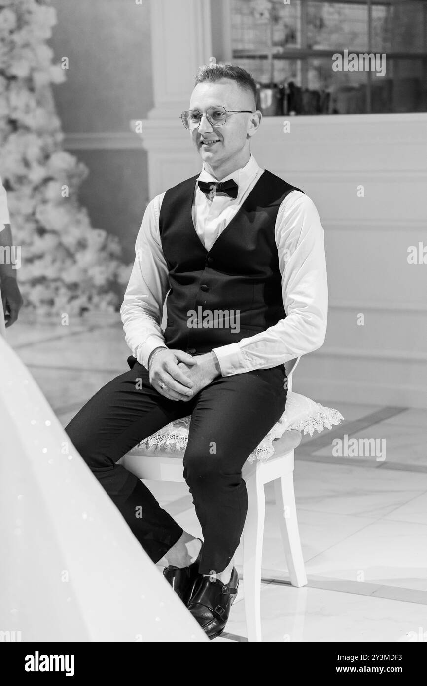 Seated elegant man in Black and White Stock Photos & Images - Alamy