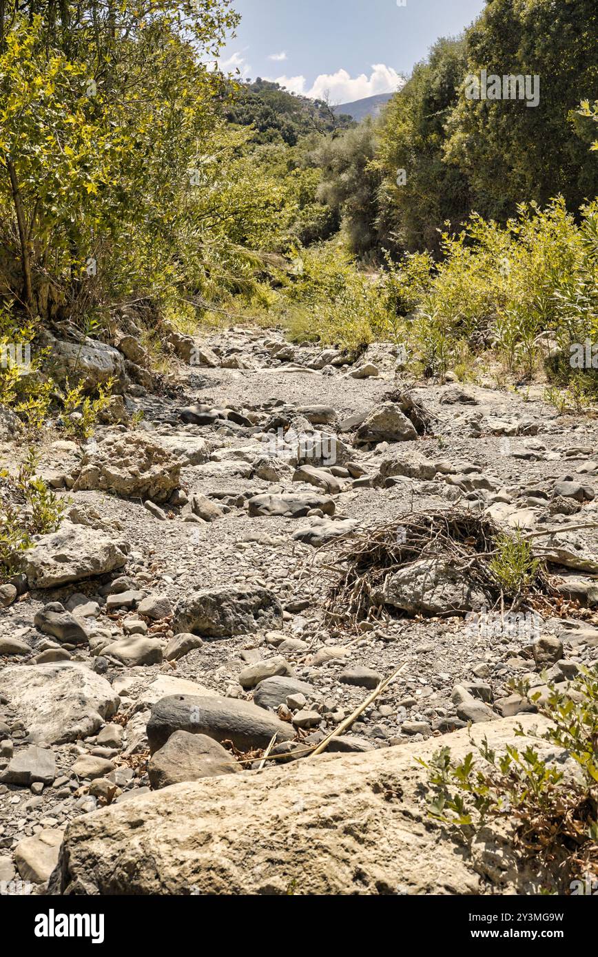 empty bed of a river that flows through a topolia gorge on the crete ...