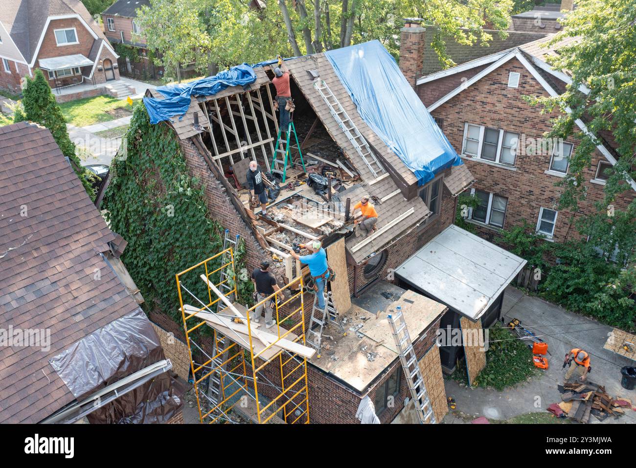 Detroit, Michigan - Workers rebuild the attic of a house damaged when a ...
