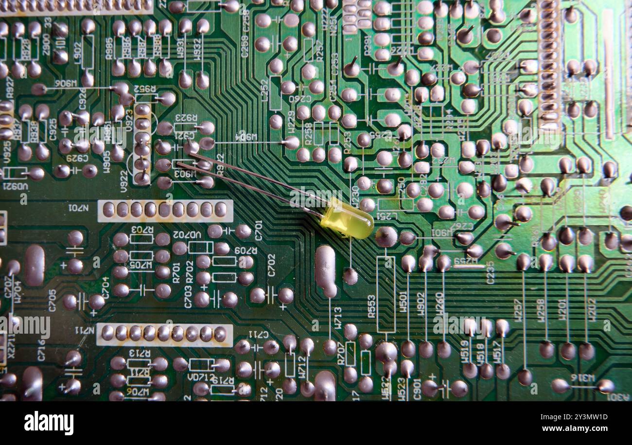 A yellow led on the soldered layer of an electronic circuit board Stock ...