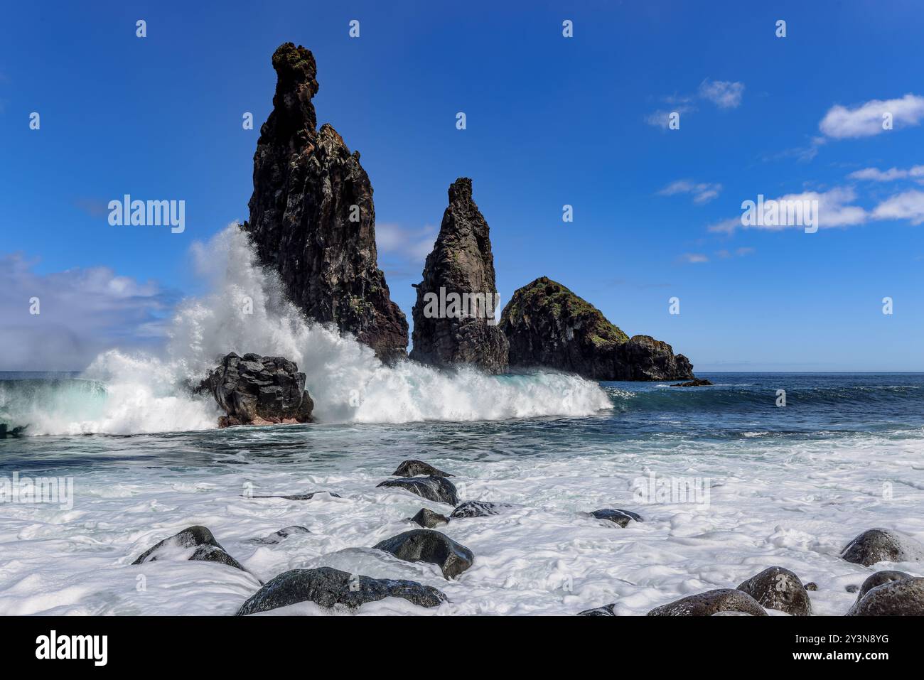 Waves breaking at the Ilheus da Janela, bizarre shaped rock formations ...