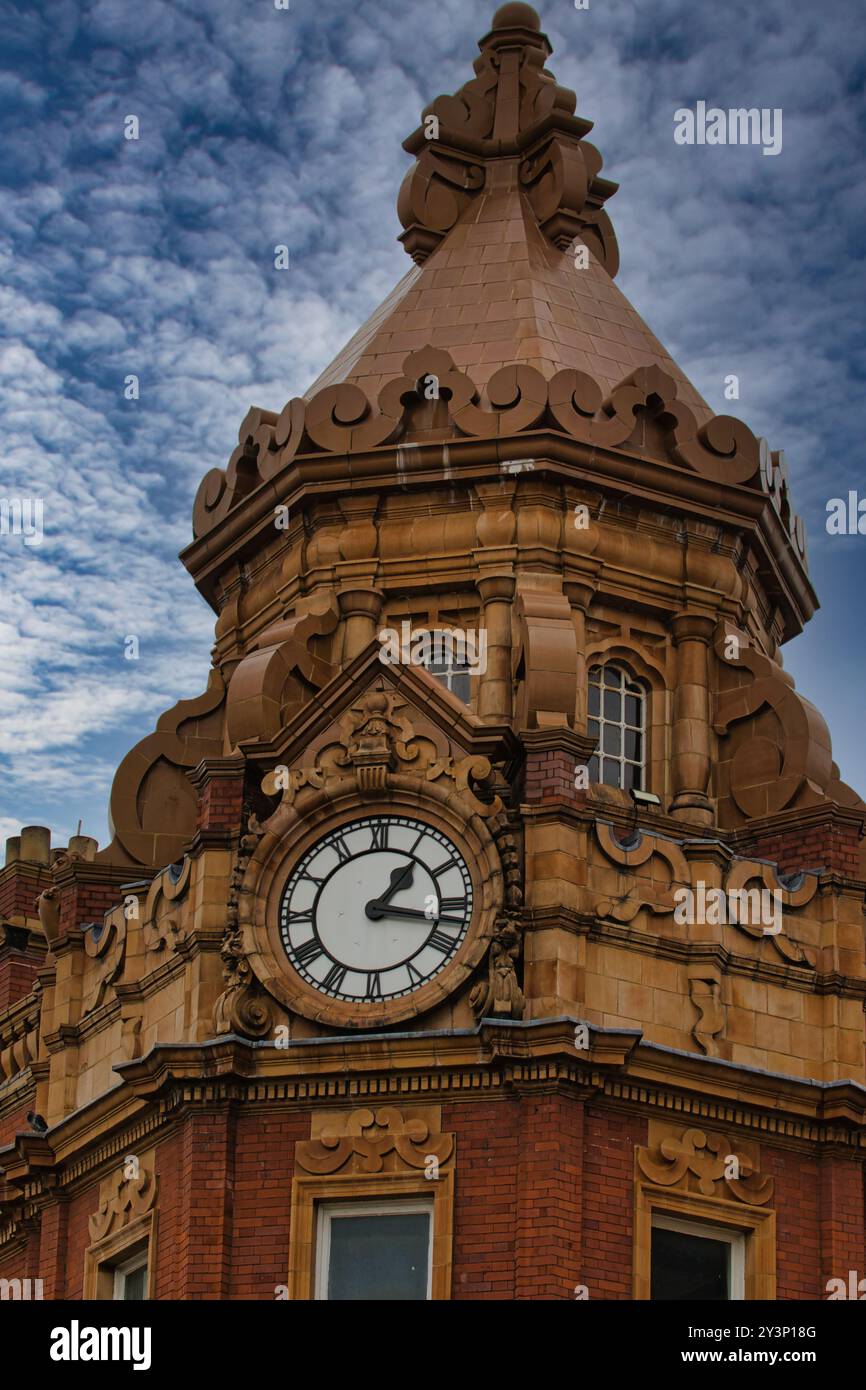 A close-up view of a historic clock tower featuring intricate ...