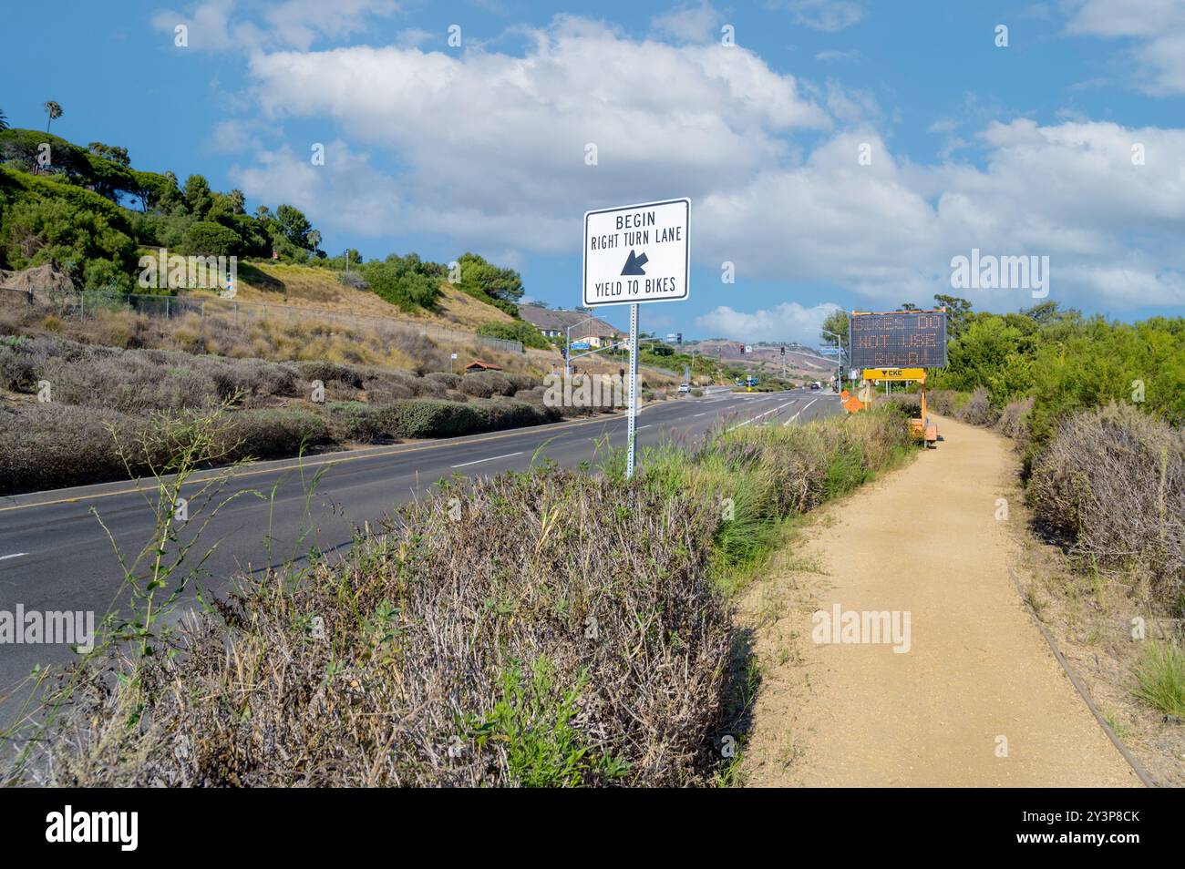 Bike lane closures due to safety concerns with ongoing land movement. Digital road sign Stock ...