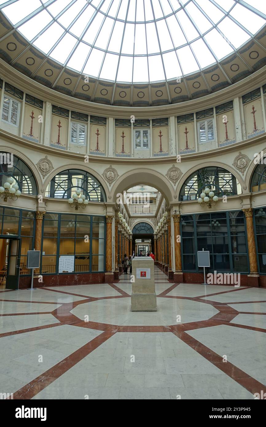 The Galerie Colbert, a typical covered passageway in Paris built in the ...