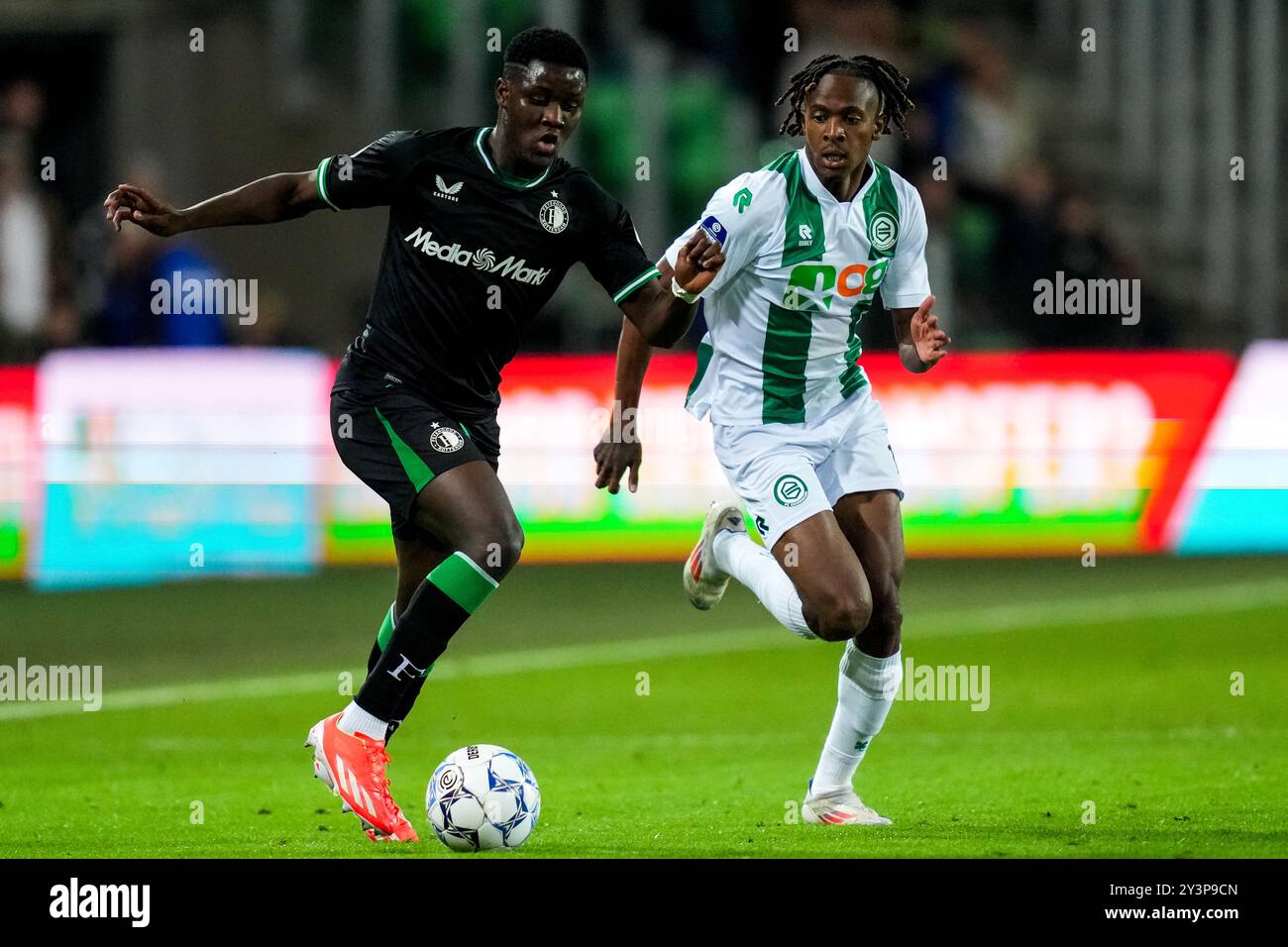 Ibrahim osman dribbles with the ball past noam emeran hi-res stock ...